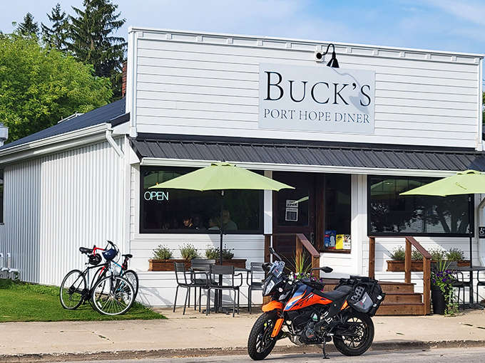 Buck's exterior welcomes hungry travelers with its crisp white siding and inviting entrance &ndash; a beacon of comfort food in Port Hope.