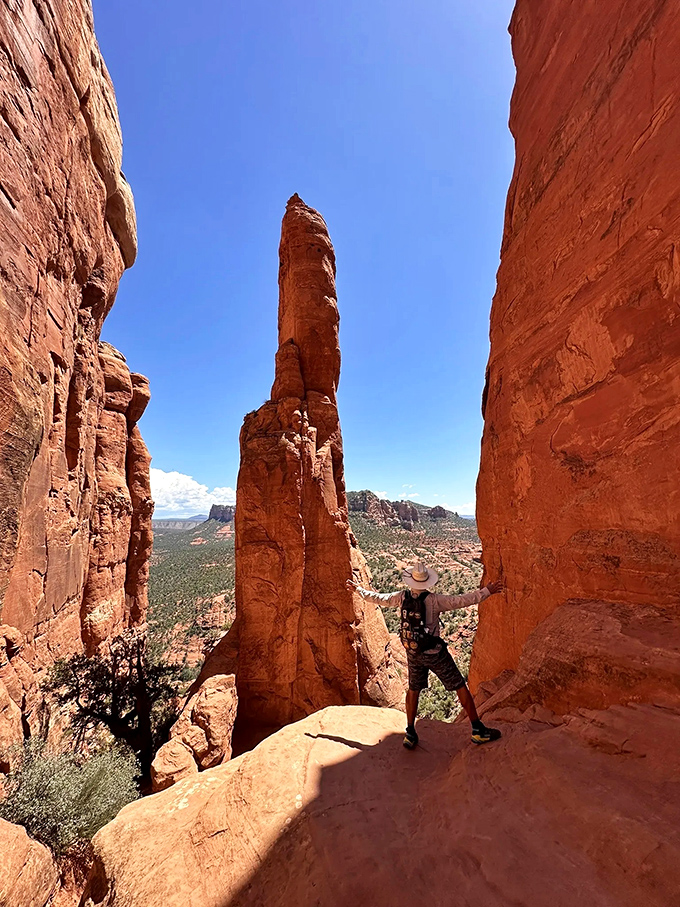 Nature's skyscraper stands proudly against the Arizona sky, a red rock cathedral where hikers worship at the altar of adventure.