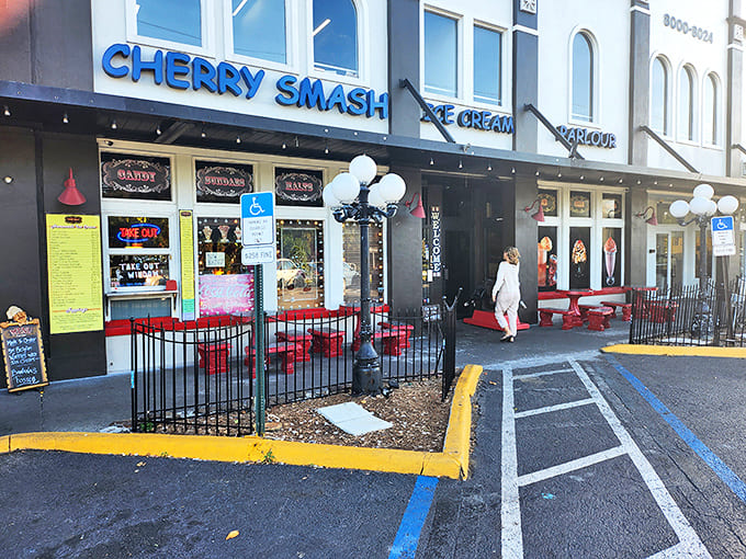 The vibrant blue Cherry Smash sign beckons sugar-seekers like a neon lighthouse guiding ships to delicious shores.
