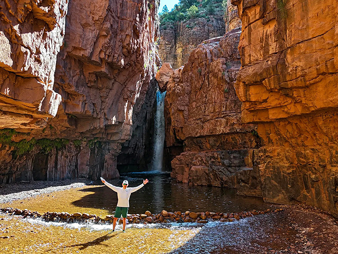 Nature's grand finale: Cibecue Falls crashes dramatically between towering canyon walls, rewarding hikers with an 80-foot spectacle of rushing white water.