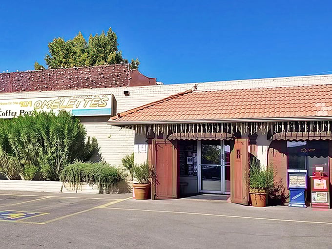 The unassuming exterior of Coffee Pot Restaurant stands like a culinary oasis amid Sedona's desert landscape, promising homestyle delights within.