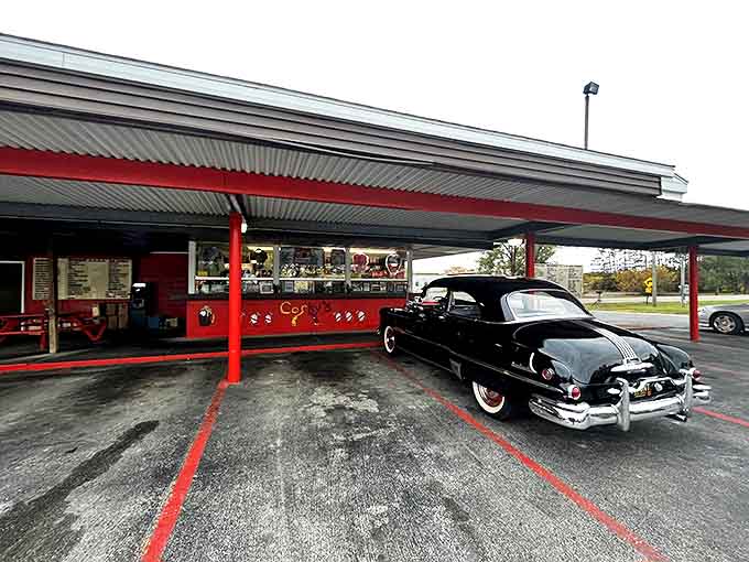 Classic Americana comes to life with vibrant red awnings and a vintage car ready for curbside service &ndash; a Michigan time capsule serving deliciousness.