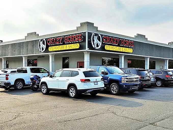 The Crazy Horse Steakhouse exterior welcomes hungry travelers with its bold signage and promise of hearty meals within.