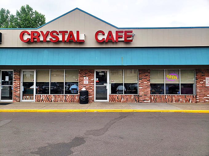 Crystal Cafe's unassuming exterior hides a breakfast paradise that locals have treasured for years. The red sign beckons hungry patrons like a delicious lighthouse.