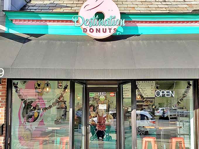 The iconic turquoise and pink sign of Destination Donuts beckons sweet-toothed travelers like a sugary lighthouse in a sea of ordinary bakeries.