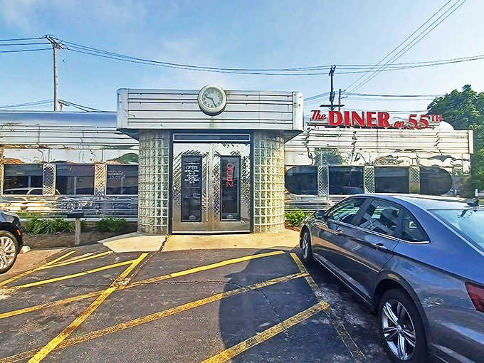 The gleaming chrome exterior of The Diner on 55th stands like a time capsule on Cleveland's streetscape, its vintage sign promising comfort and nostalgia.