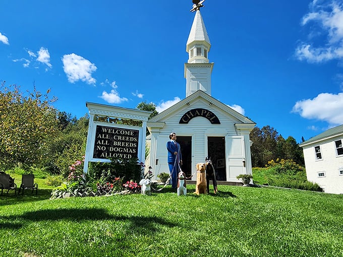 The pristine white Dog Chapel welcomes visitors with its playful sign: "All Creeds, All Breeds, No Dogmas Allowed" &ndash; a heavenly spot for four-legged pilgrims.
