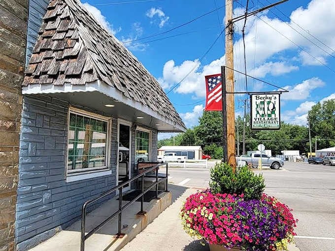 Becky's Village Restaurant stands proudly with its distinctive wooden-shingled roof and vibrant flower baskets, a humble temple to extraordinary pie-making.