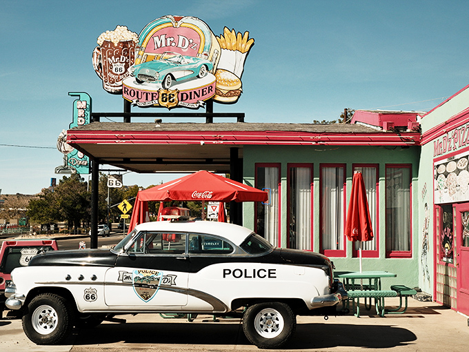 The iconic Mr. D'z sign stands proud against the Arizona sky, a beacon of nostalgia with its colorful depictions of root beer, burgers, and fries.