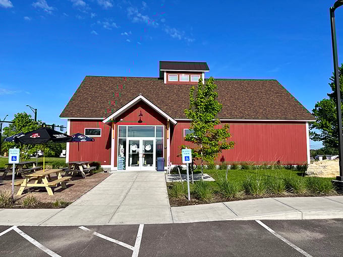 The charming red barn exterior welcomes visitors with rustic Vermont appeal &ndash; a humble facade hiding sandwich greatness within.