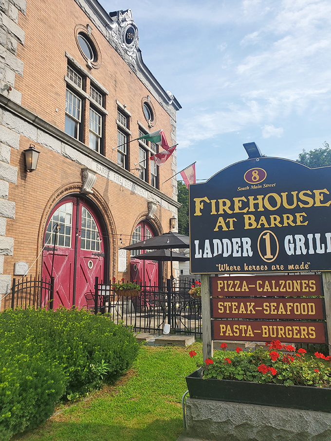 The historic Firehouse at Barre stands proudly on South Main Street, its iconic red doors and stone facade inviting hungry visitors to experience culinary magic within.