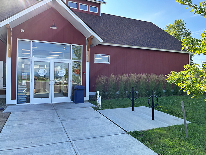 The iconic red barn exterior welcomes hungry visitors like a beacon of sandwich hope against Vermont's blue skies.