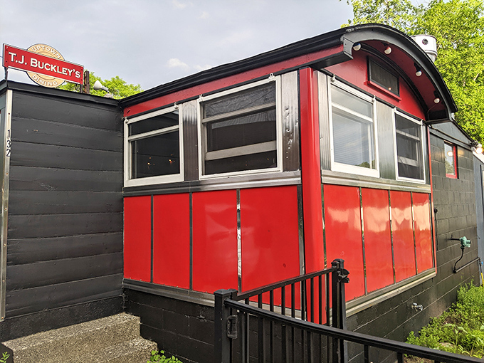 A splash of vibrant red against Vermont green – T.J. Buckley's vintage dining car exterior promises culinary adventures within its compact frame.