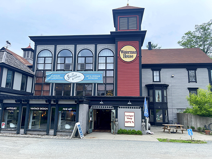 The distinctive red and black exterior of Waterman House stands as a historical landmark itself, inviting curious travelers into its treasure-filled interior.