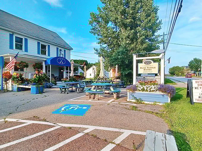 Welcome to paradise! The charming exterior of Blue Paddle Bistro beckons with its classic Vermont architecture and vibrant blue accents.