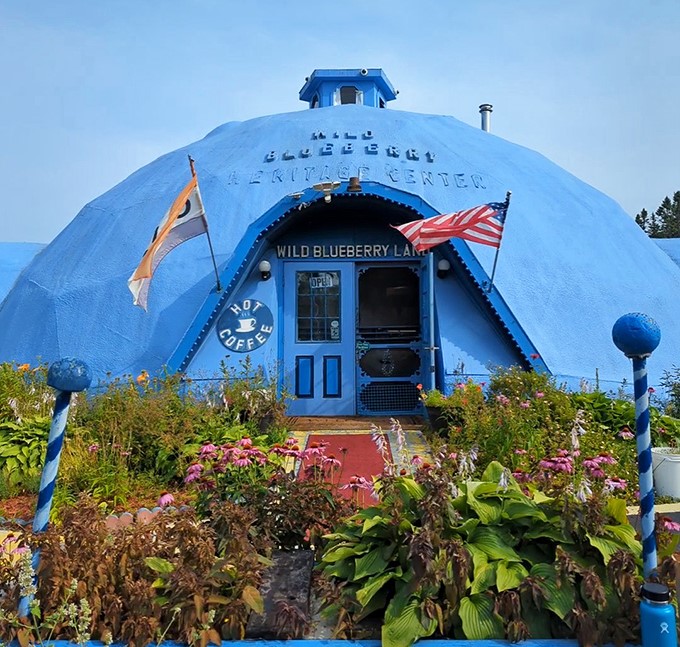 The iconic blue dome of Wild Blueberry Land stands out against the Maine sky, beckoning berry enthusiasts with its whimsical charm.
