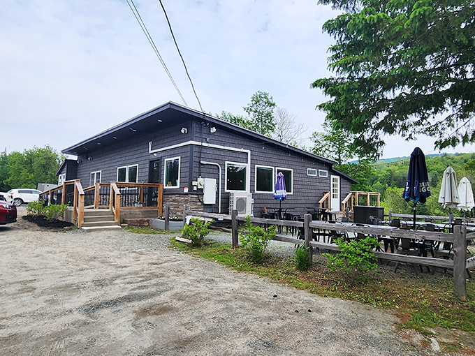 The unassuming gray exterior of The Mooselook Restaurant hides culinary treasures within, like finding a diamond in Vermont's verdant rough.