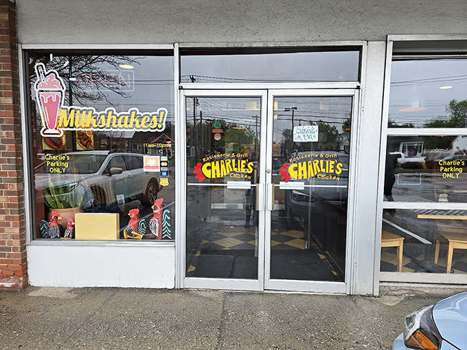 The unassuming storefront of Charlie's Chicken belies the flavor explosion waiting inside. That neon milkshake sign is your first clue to greatness.