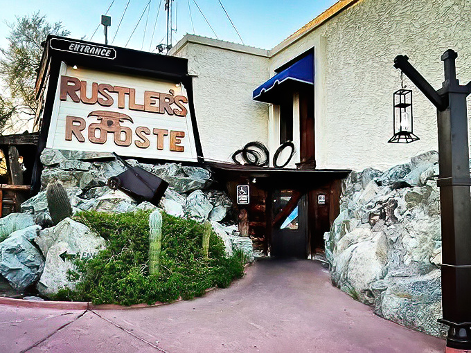 The rugged stone entrance to Rustler's Rooste welcomes hungry cowboys and city slickers alike with Western charm and the promise of adventure.