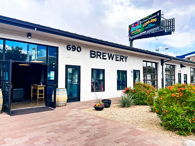 The unassuming white facade of Hundred Mile Brewing Company hides culinary treasures within, like finding a speakeasy in plain sight.