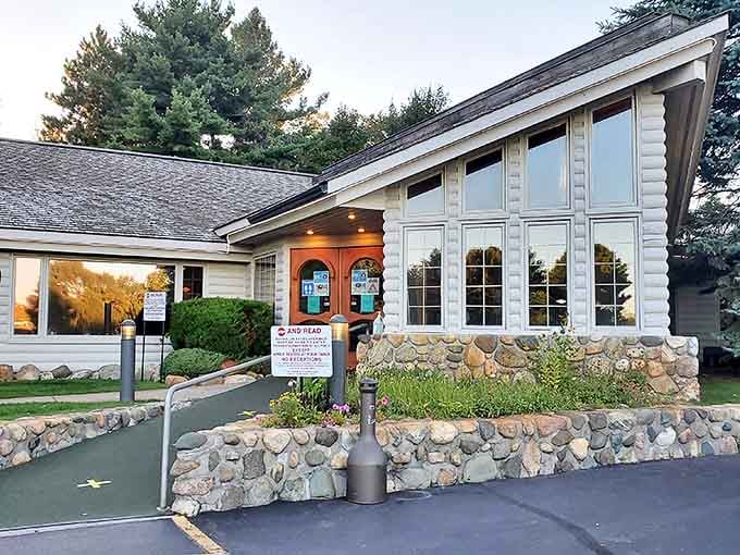 Where rustic charm meets culinary excellence, this log cabin restaurant stands like a delicious mirage in the northern Michigan woods.