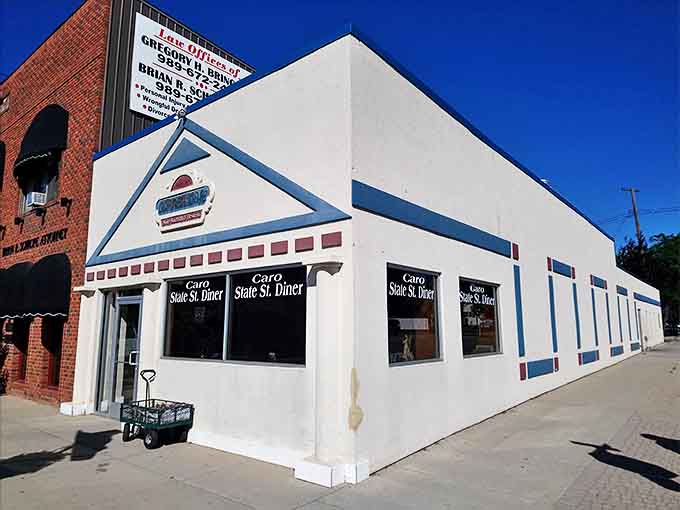 The unassuming white exterior of Caro State Street Diner hides a treasure trove of comfort food classics that locals have cherished for generations.