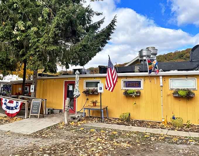 The cheerful yellow exterior of The Southerner beckons hungry travelers with its American flag and promise of Southern comfort food by the water.