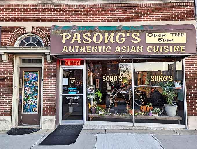 Pasong's storefront might be modest, but that weathered sign marks the spot where culinary magic happens. Like finding a secret doorway to flavor paradise!