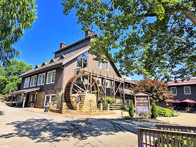 The historic mill stands proudly with its iconic water wheel, promising sweet treasures inside that go beyond just dessert.