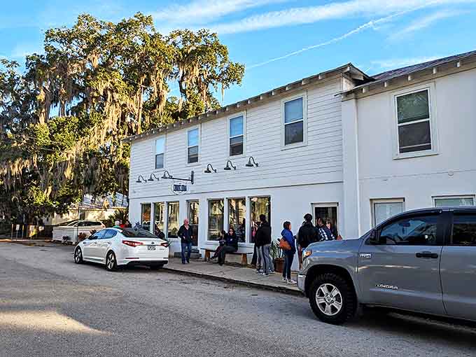 The unassuming white exterior of The Blue Hen Caf&eacute; belies the culinary treasures within. That line of people? They know what's coming.