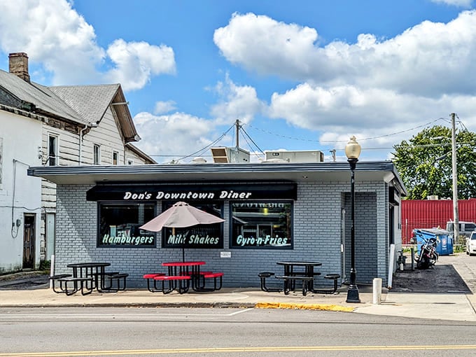 Don's Downtown Diner's charming white brick exterior promises simple pleasures with its straightforward signage &ndash; hamburgers, milkshakes, and gyros await inside this unassuming neighborhood gem.