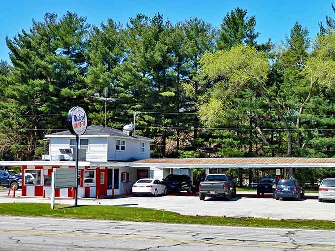 A slice of 1950s Americana stands proudly along Red Arrow Highway, its red trim and classic signage beckoning hungry travelers to step back in time.