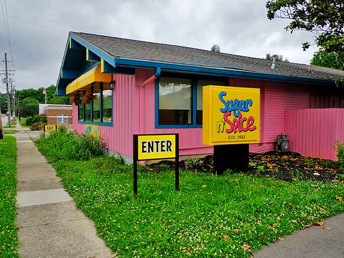 The hot pink exterior of Sugar n' Spice screams "fun inside!" like a carnival barker who majored in breakfast studies.