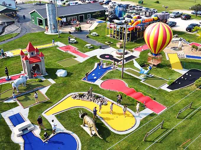 Aerial view of Fondy Sports Park reveals a colorful playground paradise where family feuds are temporarily settled through mini-golf domination and go-kart supremacy.