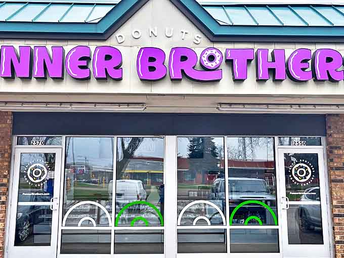The vibrant purple signage of Funner Brothers beckons sweet-toothed adventurers like a neon lighthouse in a sea of ordinary storefronts.