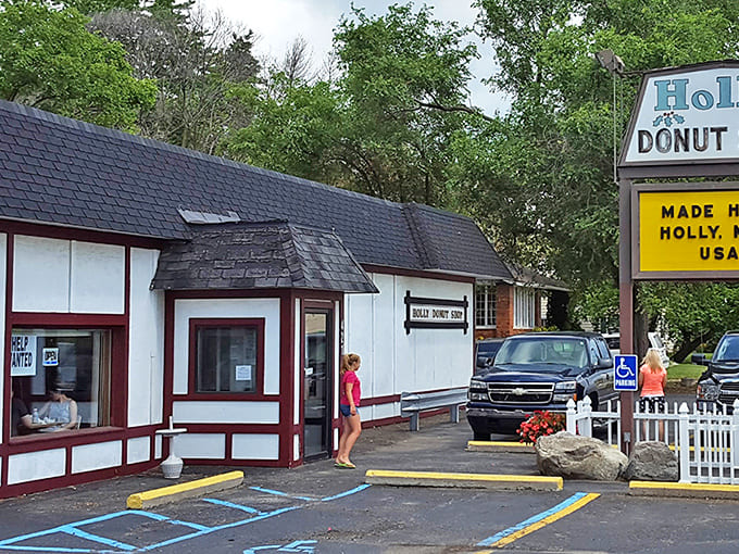 The charming exterior of Holly Donut Shop beckons with its red-trimmed windows and humble facade &ndash; a sweet treasure hiding in plain sight.