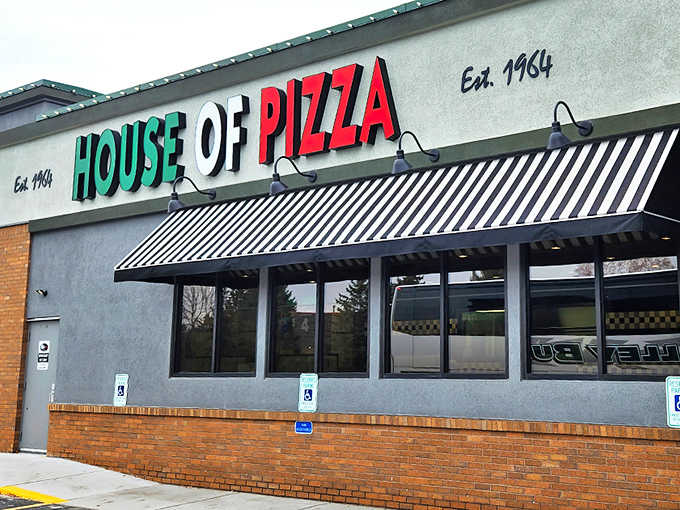 The iconic green, white, and red signage of House of Pizza stands as a beacon for hungry St. Cloud residents since 1964.