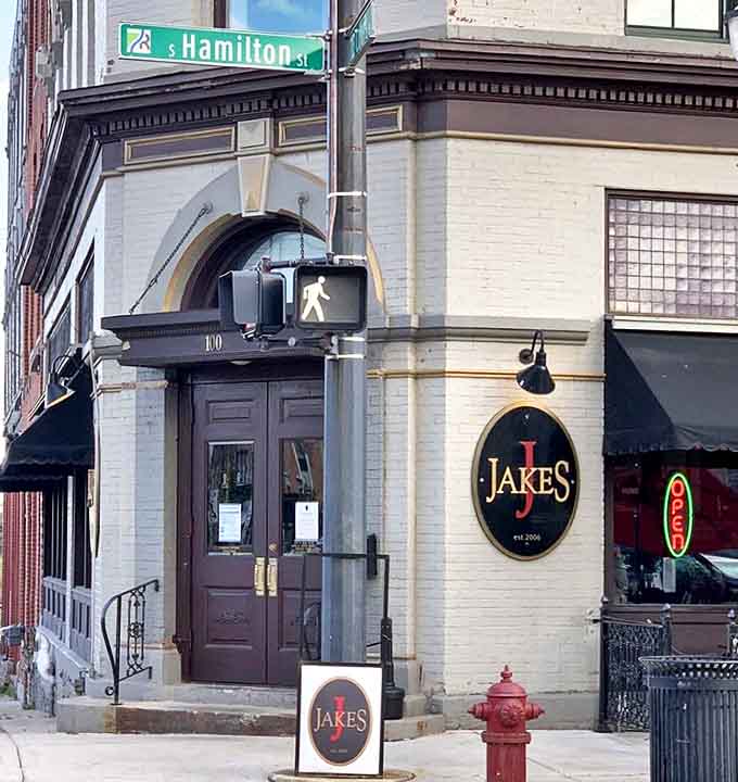 The historic cream-colored building housing Jake's Old City Grill stands proudly at the corner of Hamilton Street, a beacon of culinary excellence in downtown Saginaw.