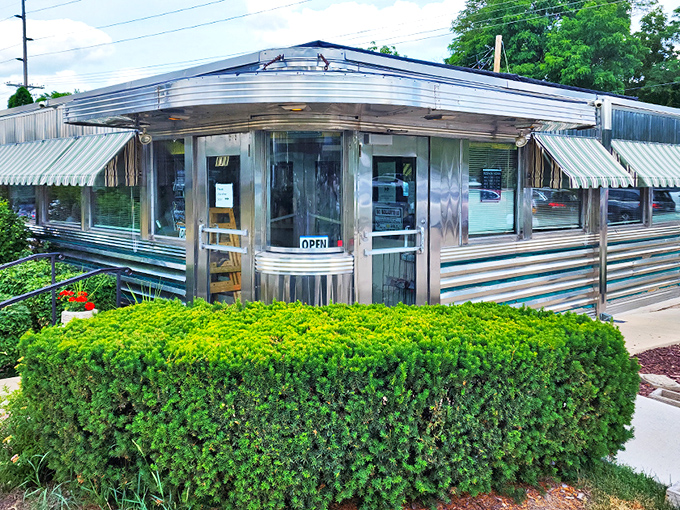 A gleaming stainless steel time machine disguised as a diner – Joni's exterior shines like a beacon for hungry travelers seeking comfort food nirvana.