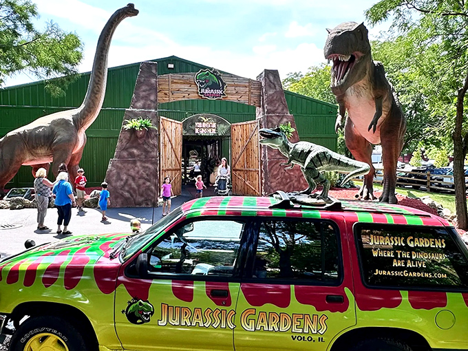 The jaw-dropping entrance to Jurassic Gardens, where towering dinosaurs stand guard like prehistoric bouncers at Earth's most ancient nightclub.