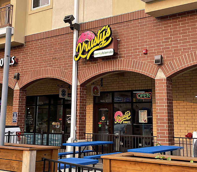 The unassuming brick exterior of Krusty's Donuts hides a world of sweet treasures within, like finding a diamond in a plain paper bag.