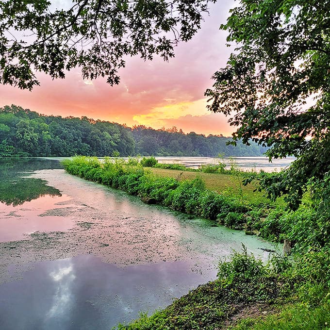 Sunset paints the sky in watercolor hues at Lake Le-Aqua-Na, where the water mirrors nature's evening show with perfect stillness.