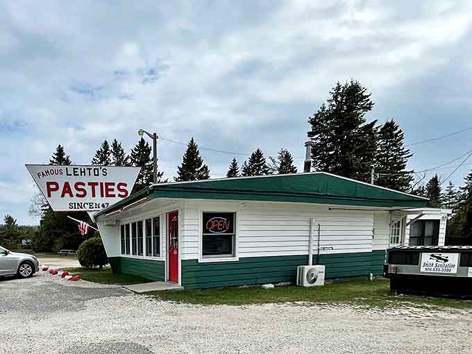 The iconic green and white exterior of Lehto's Pasties stands as a beacon for hungry travelers along US-2, promising handcrafted comfort in every bite.