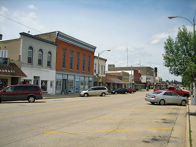 Lena's main street looks like it was designed by someone who actually understood that towns should be pleasant places for humans, not just cars.