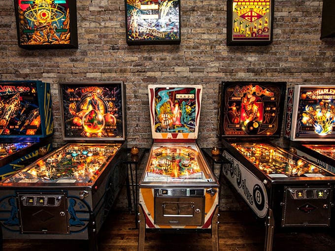 Logan Arcade: Where the hypnotic glow of vintage pinball machines transforms an ordinary night into an electric journey through gaming history.