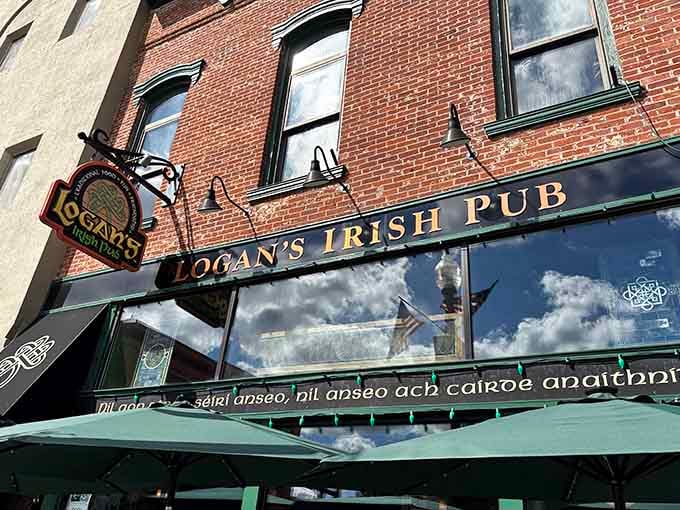 That green awning and Celtic knot logo aren't just decoration; they're a promise of the authentic Irish experience waiting inside this Findlay treasure.