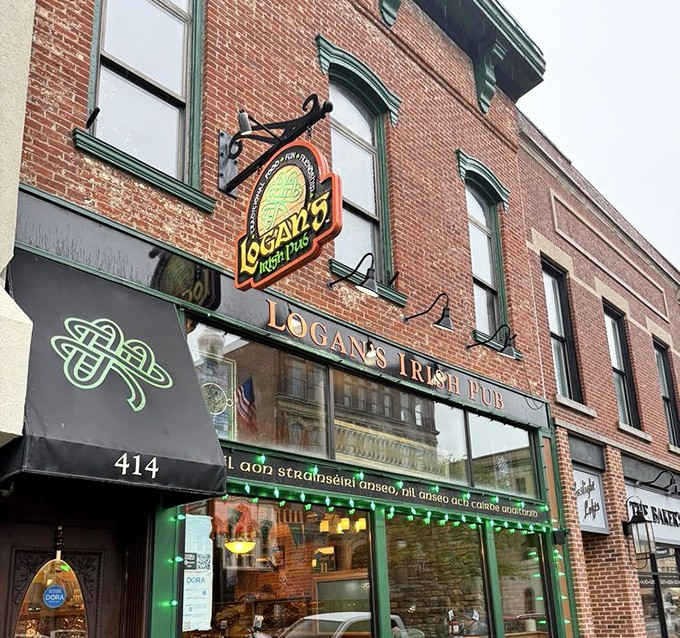 The emerald-trimmed brick facade of Logan's Irish Pub beckons like a Celtic oasis in downtown Findlay, promising authentic Irish hospitality within.