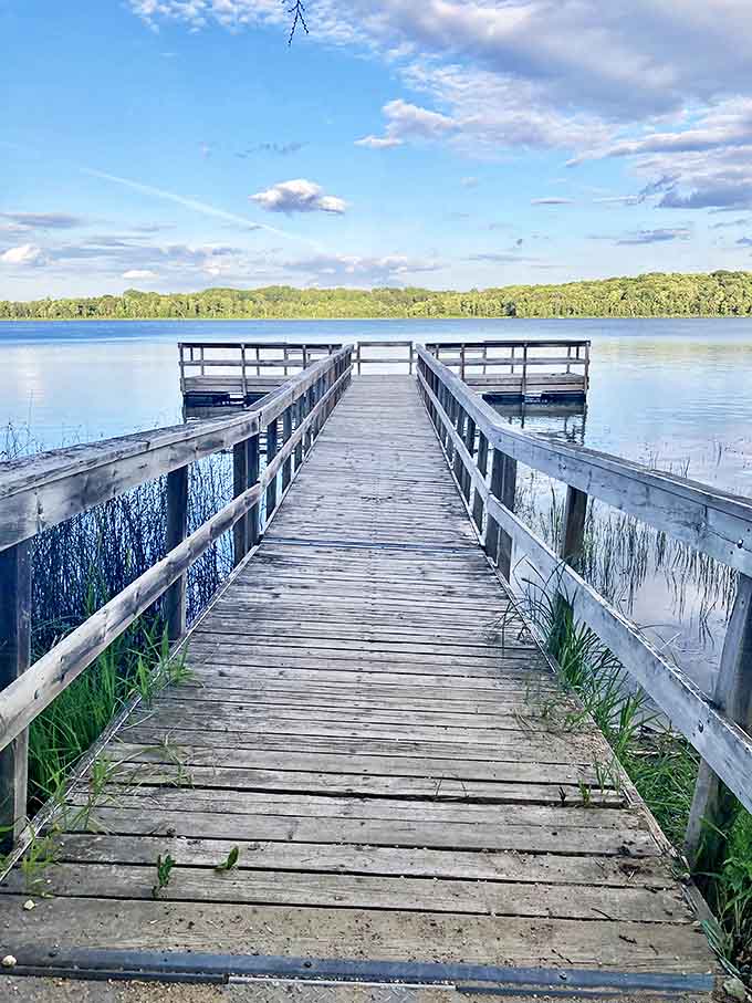Welcome to paradise! Maplewood State Park's wooden dock stretches into crystal-clear waters, inviting you to leave your worries on shore.