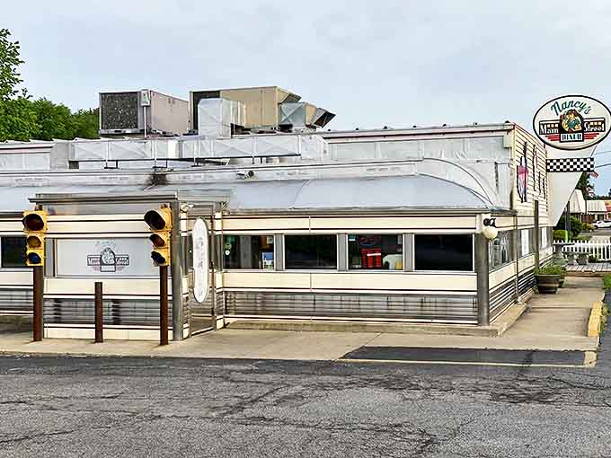 The gleaming stainless steel exterior of Nancy's Main Street Diner stands like a time capsule on Grafton's main drag, promising authentic 1950s charm inside.