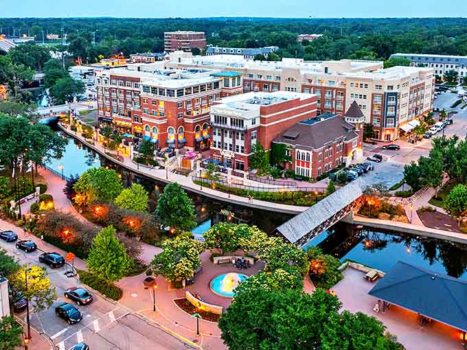 Naperville's skyline glows at dusk, where brick buildings and modern amenities create a perfect suburban symphony along the DuPage River.